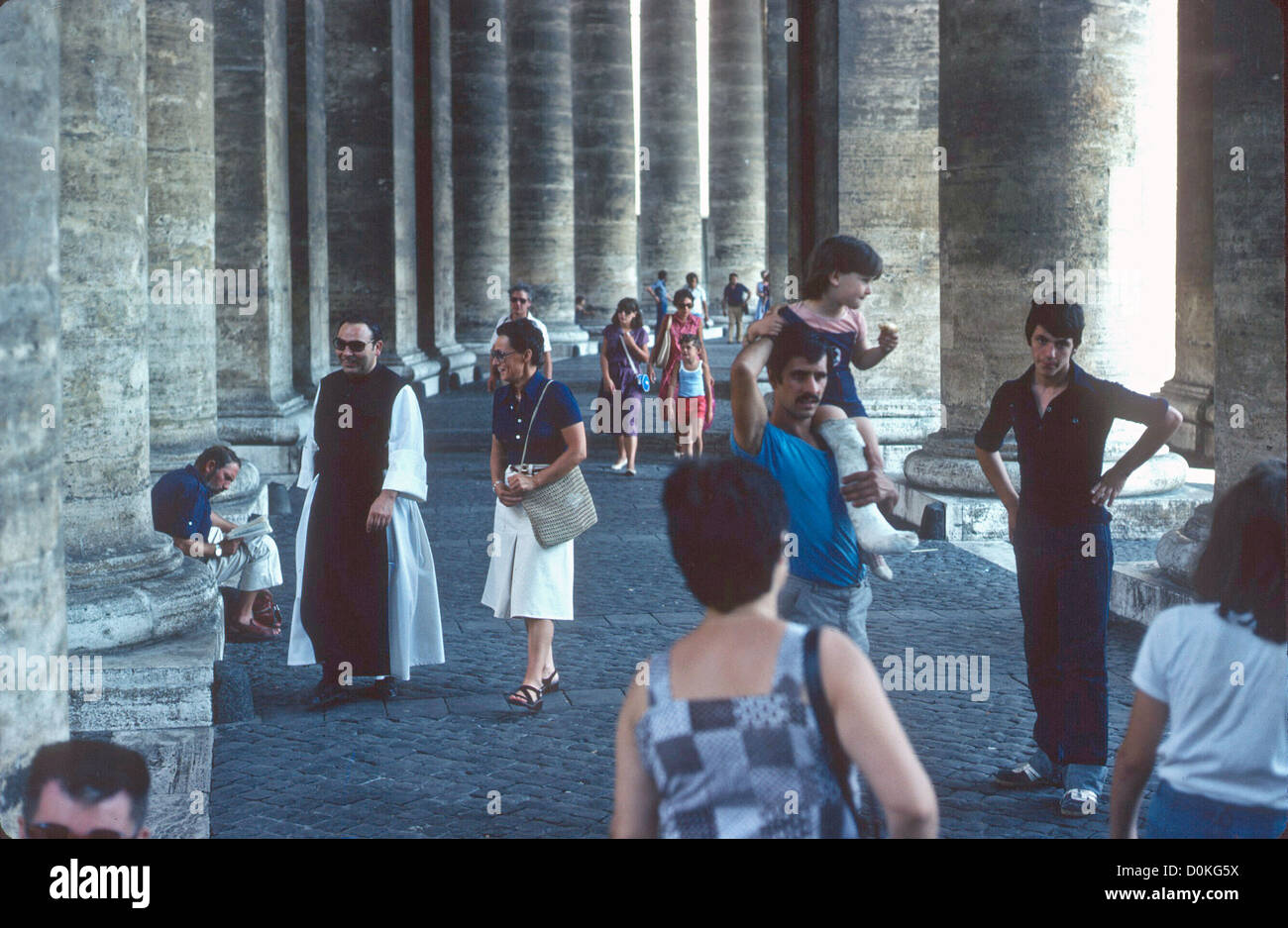 PEOPLE CONGREGATE IN THE SHADE OF BERNINI'S COLLONADE VATICAN ROME ...