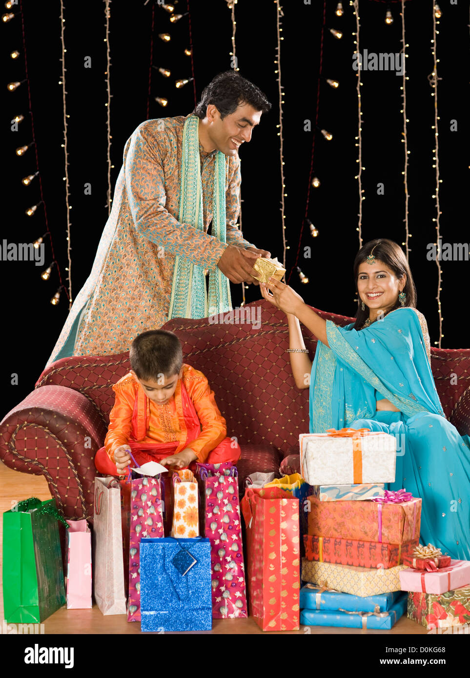 Indian man giving gift son hi-res stock photography and images - Alamy