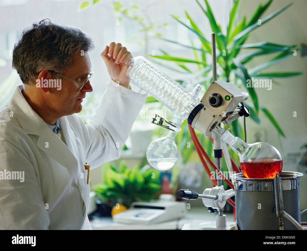 A chemical researcher using a rotary evaporator Stock Photo - Alamy