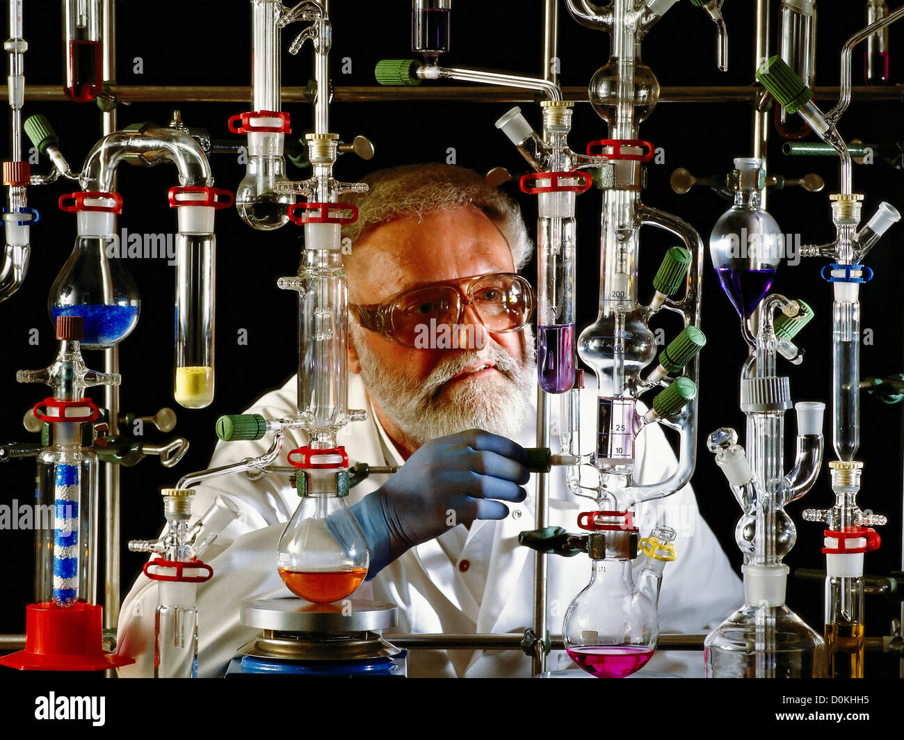 A researcher carrying out an experiment in a laboratory Stock Photo - Alamy