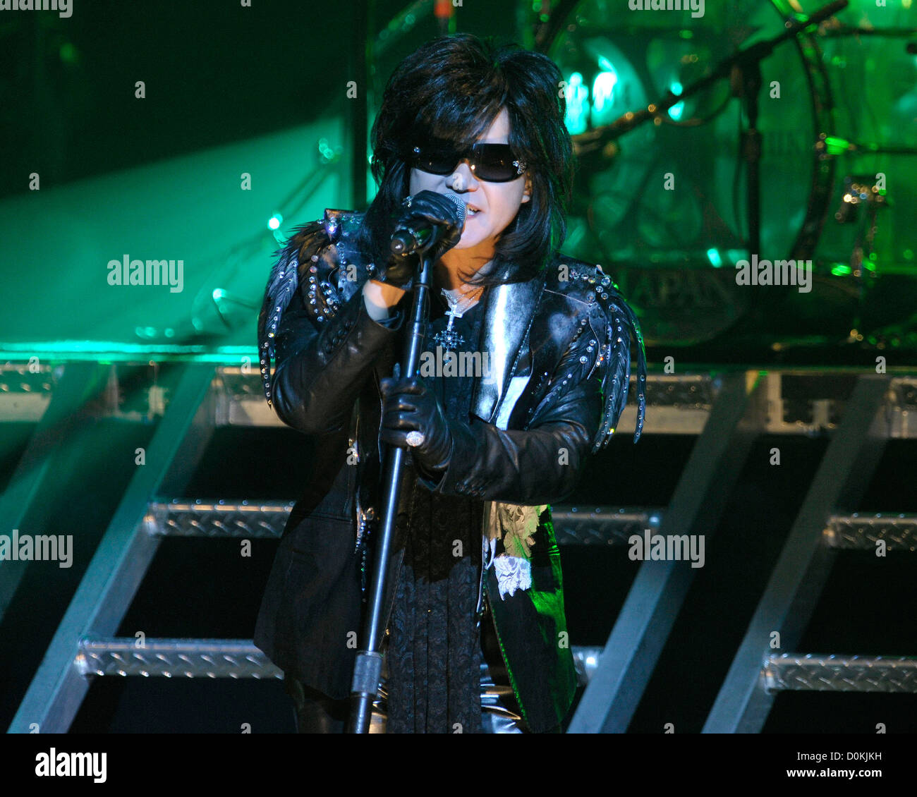 Toshimitsu 'Toshi' Deyama of 'X Japan' performing on stage at Massey ...