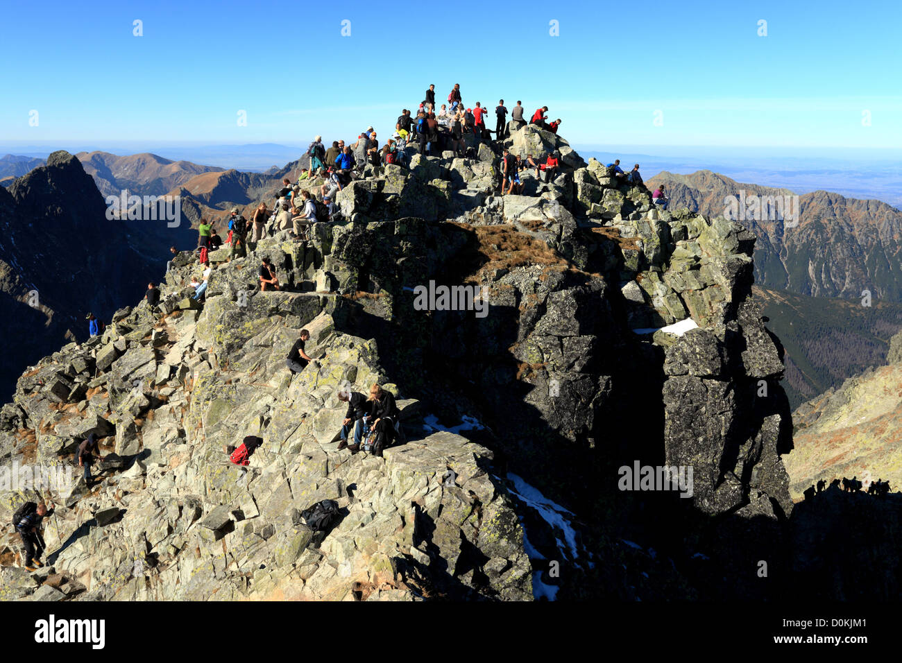 Hikers at the summit of peak Rysy, High Tatras, Slovakia Stock Photo ...