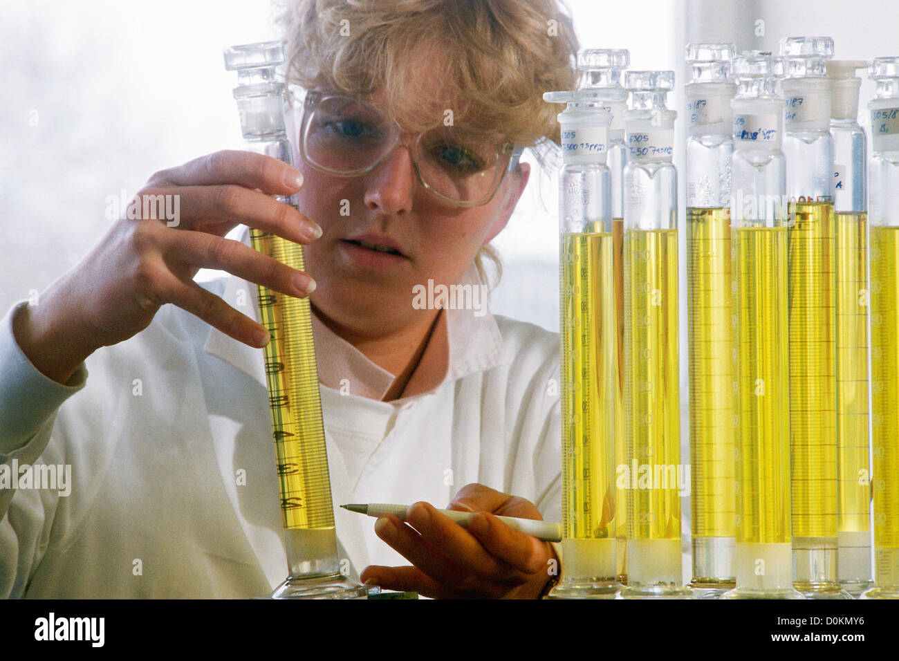 A young chemist in a laboratory checks oil samples Stock Photo - Alamy