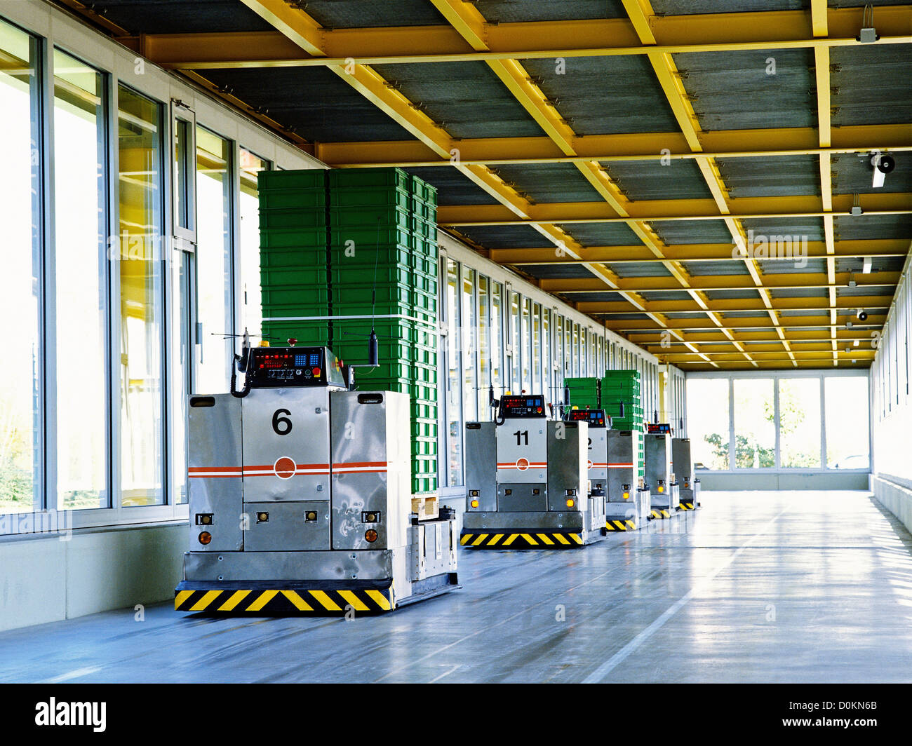 Automatic guided vehicles (AGV) are factory robots carrying materials ...