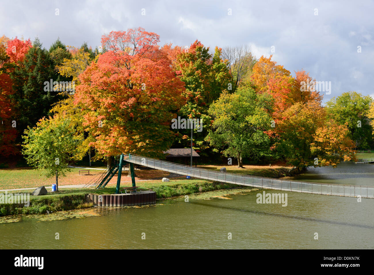 Walking Suspension Bridge Over Water In Autumn Fall MI Stock Photo - Alamy