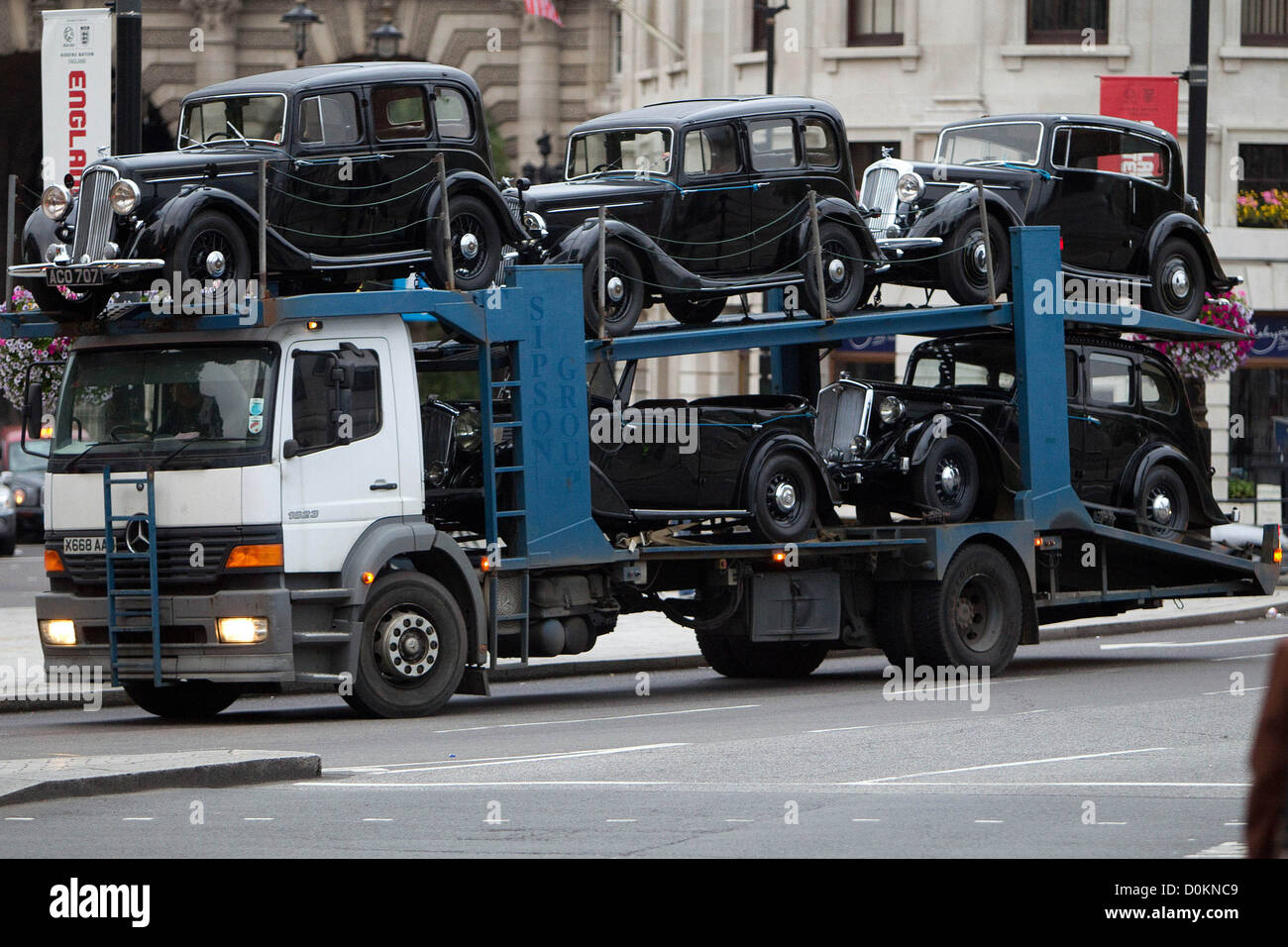Vintage cars are delivered to Trafalgar Square during the filming of ...