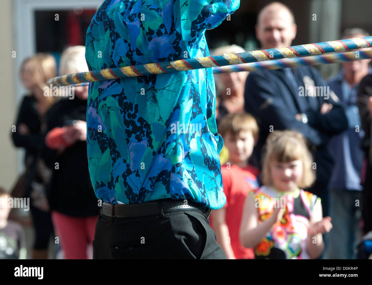 Man doing hula hoop show Stock Photo - Alamy