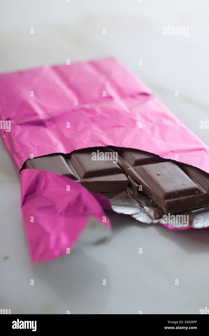 Chocolate with pink wrapping Stock Photo - Alamy