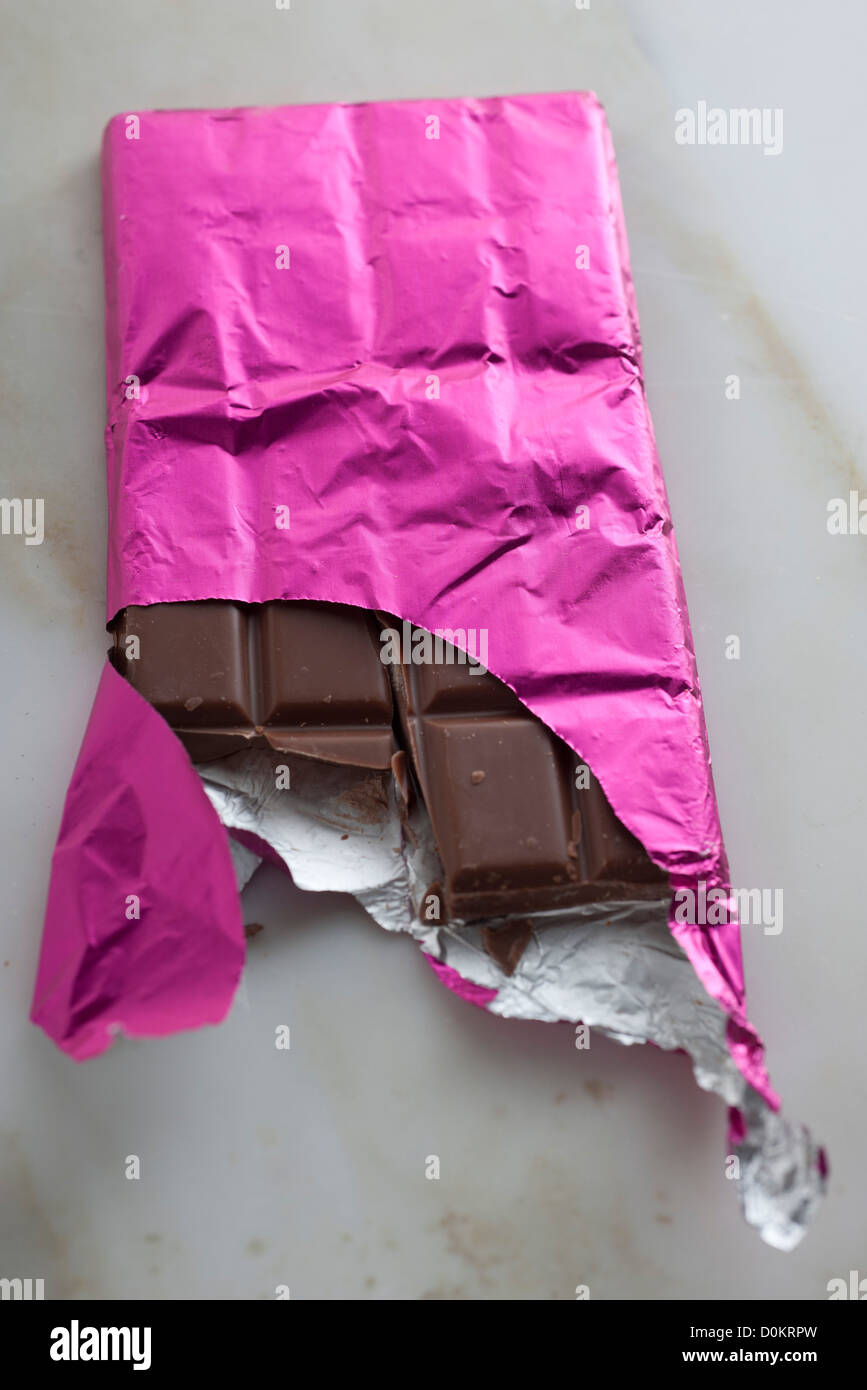 Chocolate with pink wrapping Stock Photo - Alamy