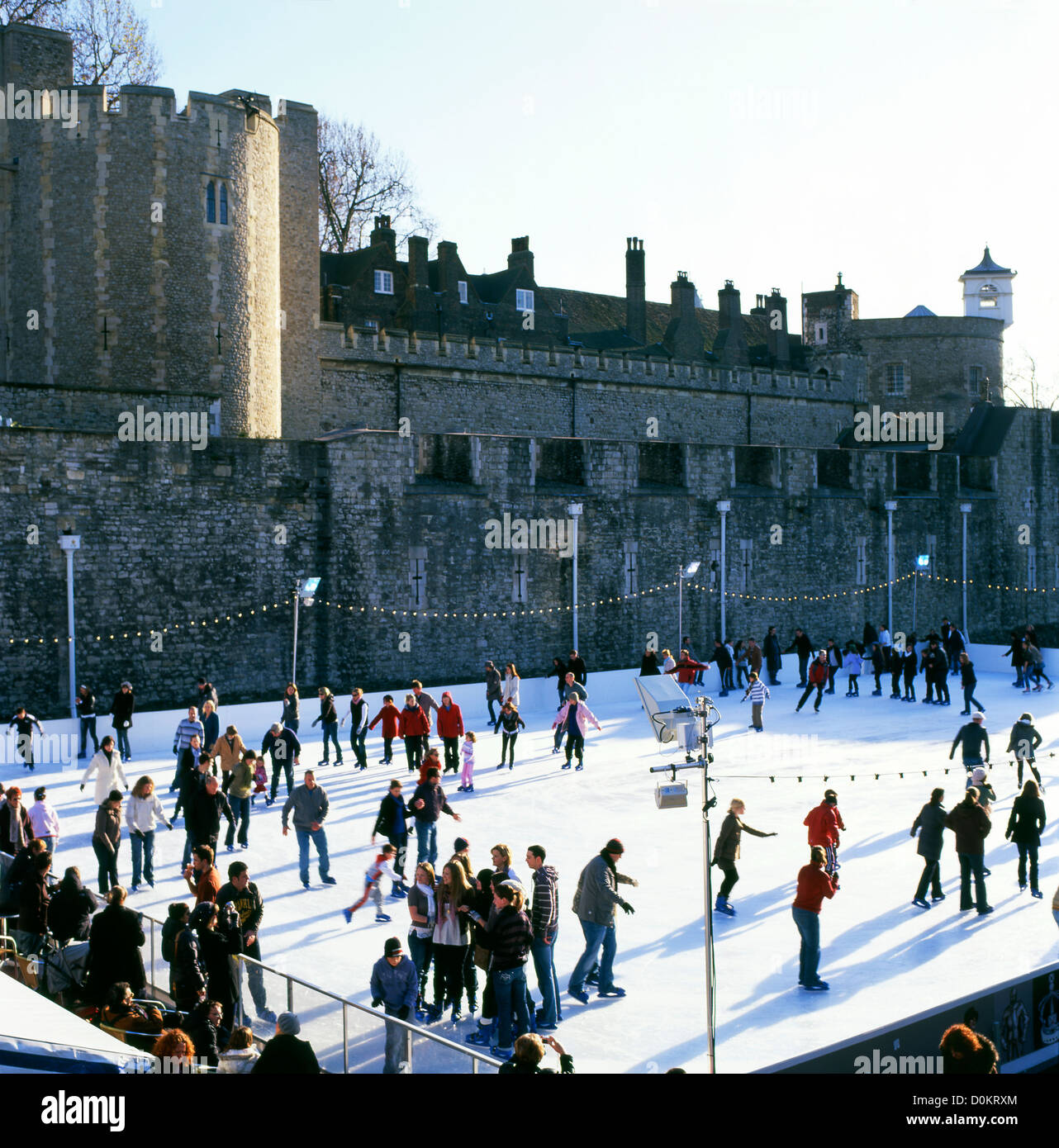 Iceskating at Tower Bridge ice rink, London England, UK KATHY DEWITT ...