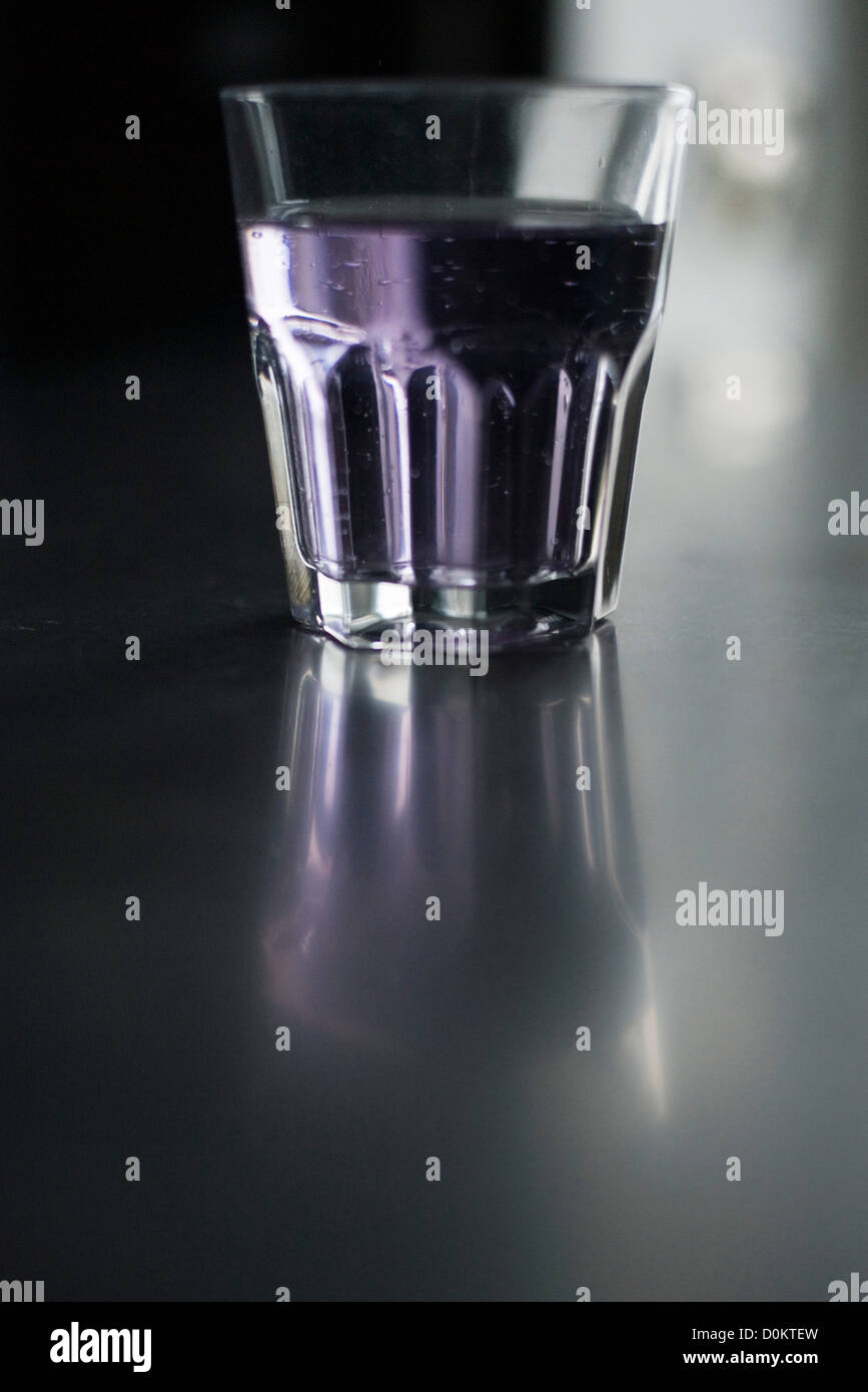 Water glass violet syrup Stock Photo - Alamy