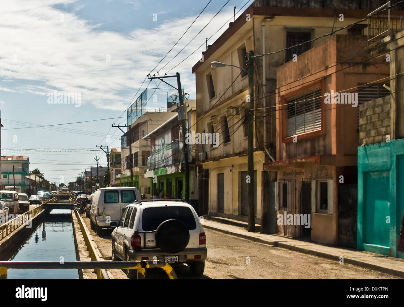 A canal divides the streets of Belize Stock Photo - Alamy
