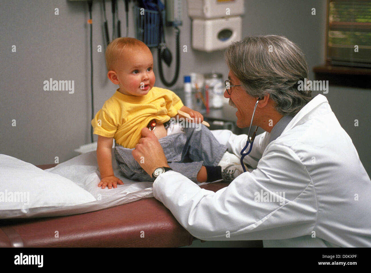 Pediatrician Examining Baby Boy Stock Photo - Alamy