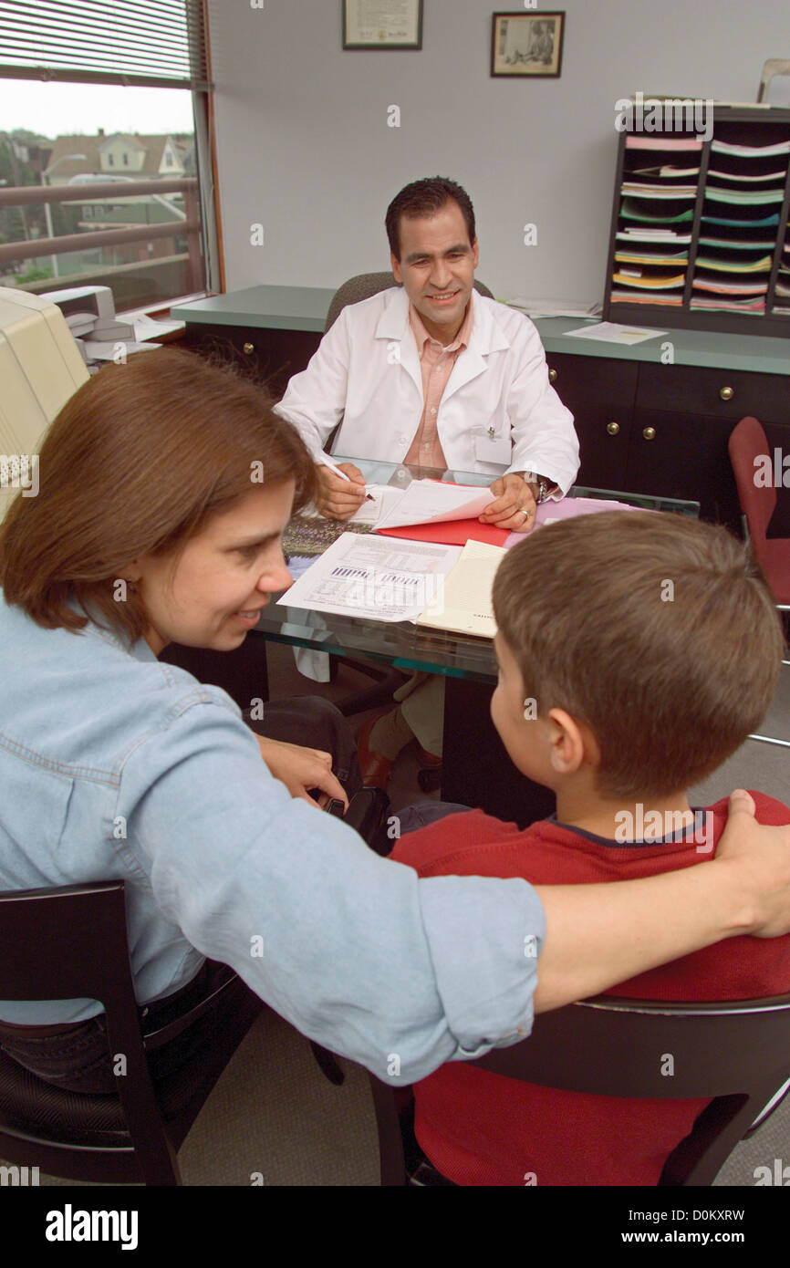 Mother and Son Discuss Options with Pediatrician Stock Photo - Alamy
