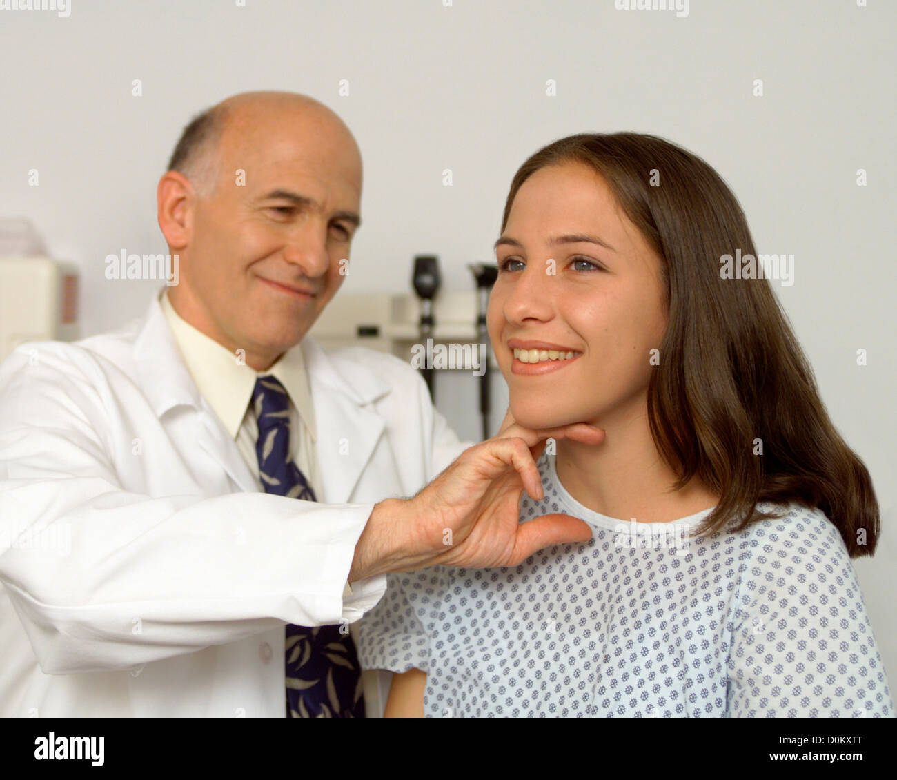 Physician Feels Lymph Nodes of Teenage Girl Stock Photo - Alamy