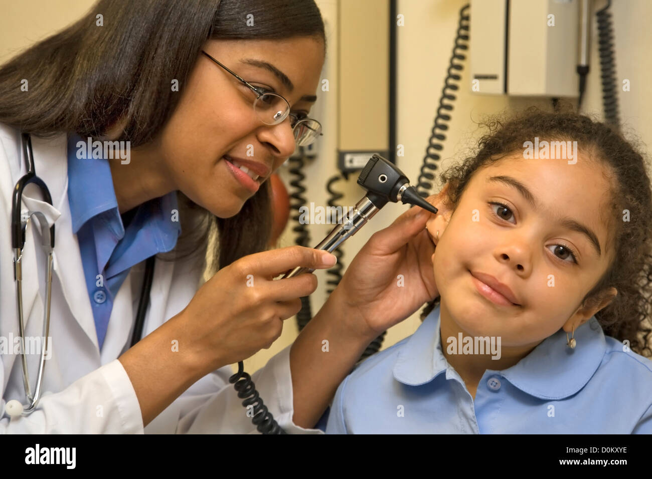 Pediatrician Examining Child Stock Photo - Alamy