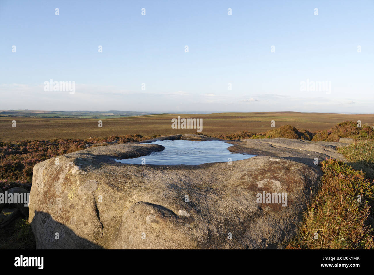 Stanage Edge in the Derbyshire Peak District, England. Water pool cut ...