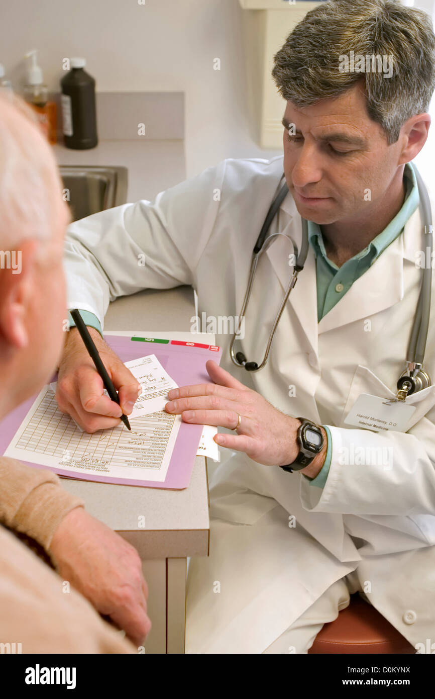 Doctor Making Note Stock Photo - Alamy