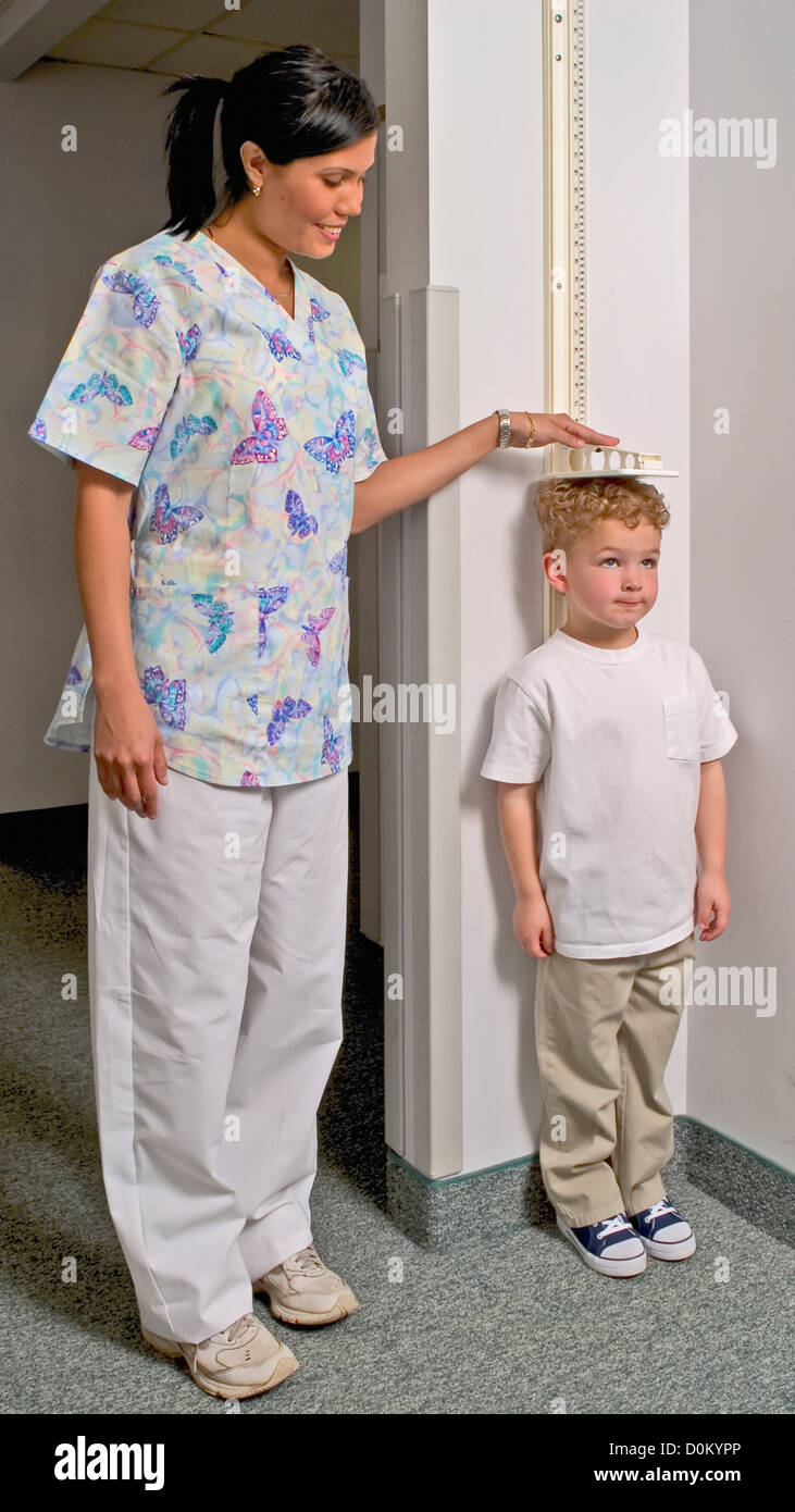 Nurse Measuring Height Stock Photo - Alamy