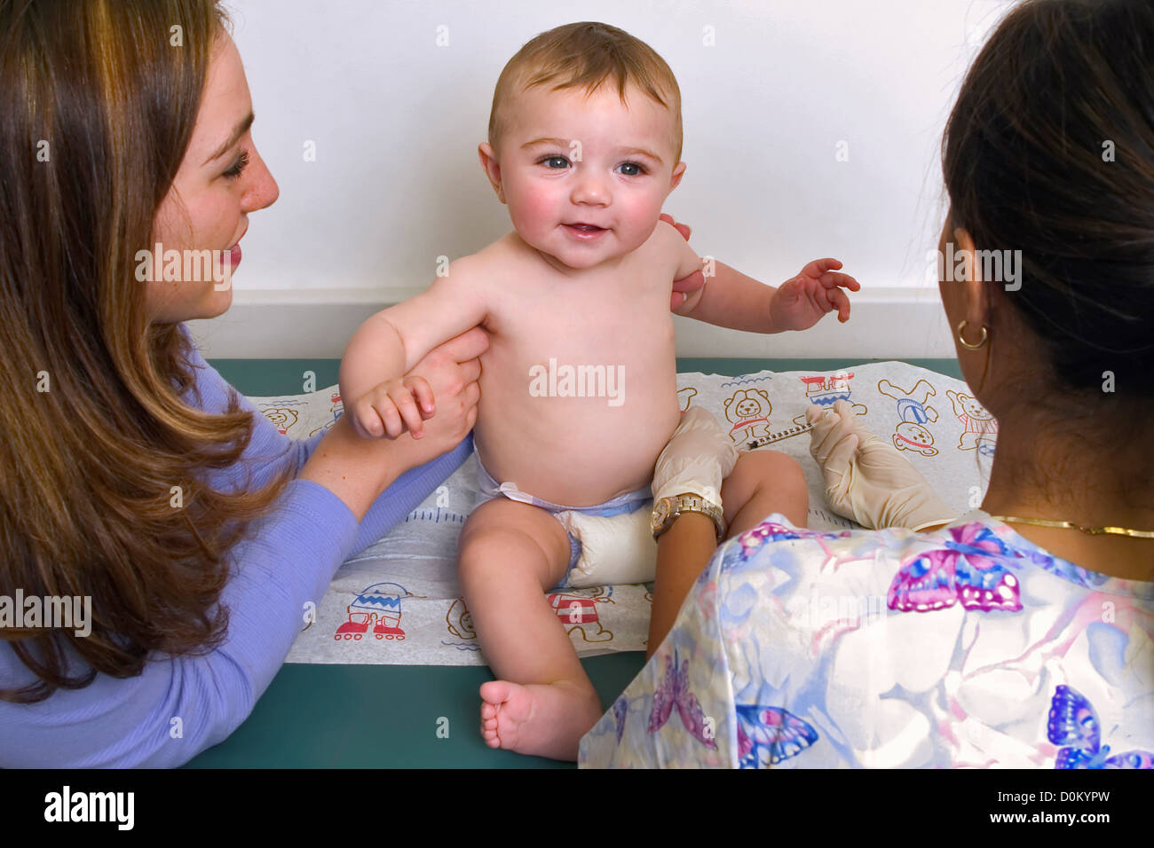 Smiling Baby Getting Injection Stock Photo - Alamy