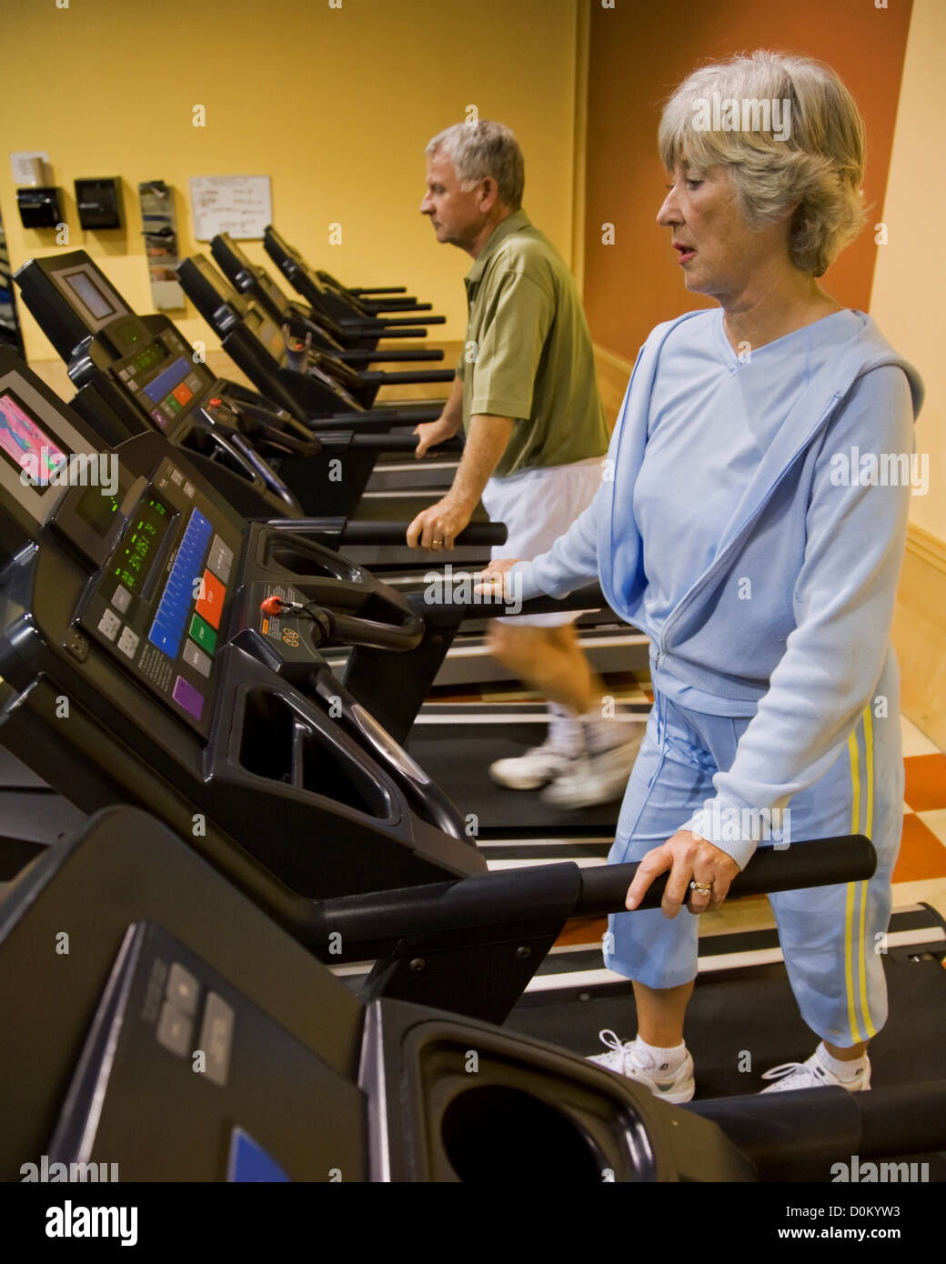 Couple Using Treadmills Stock Photo - Alamy