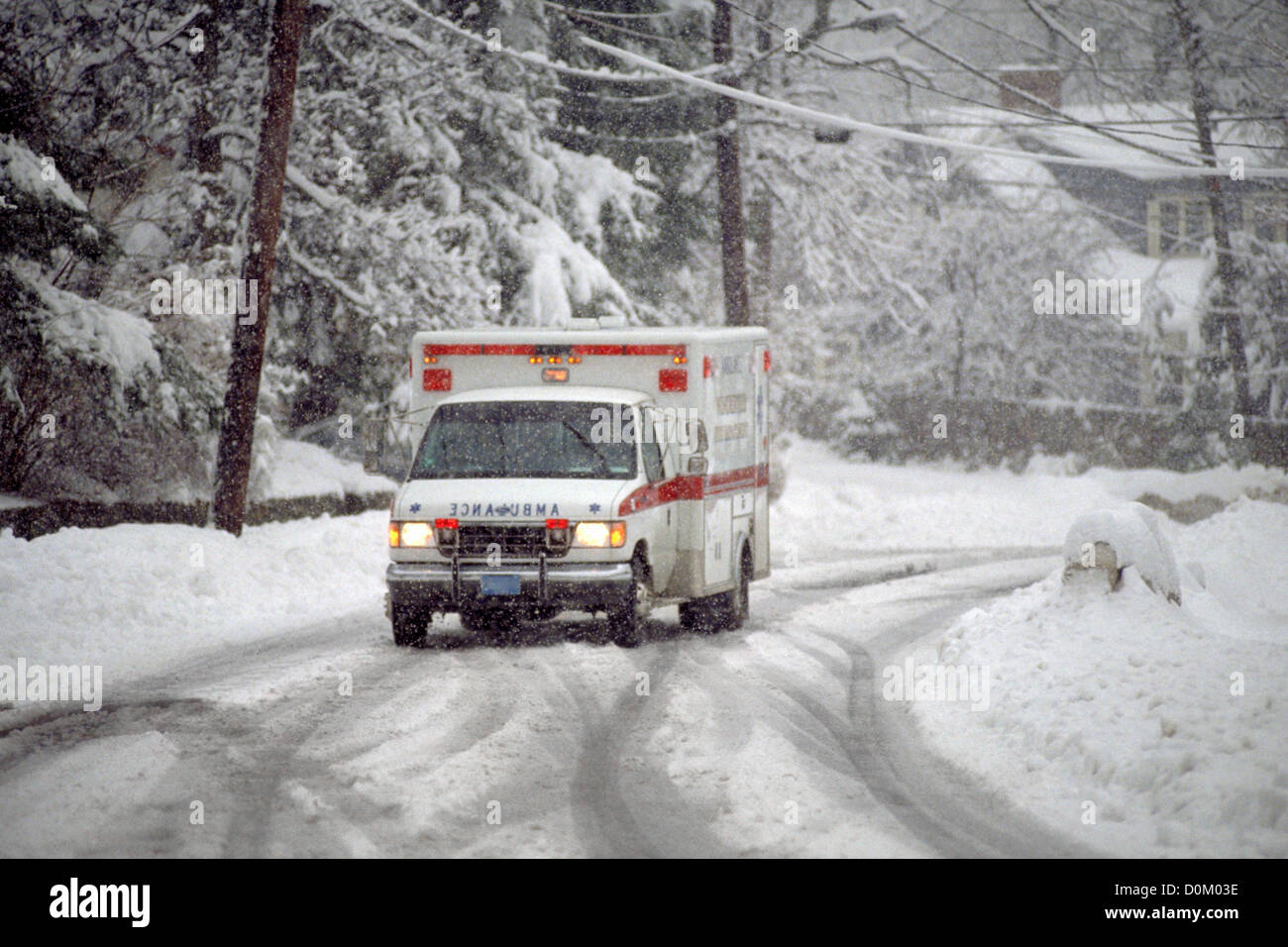Ambulance Driving in a Snowstorm Stock Photo - Alamy