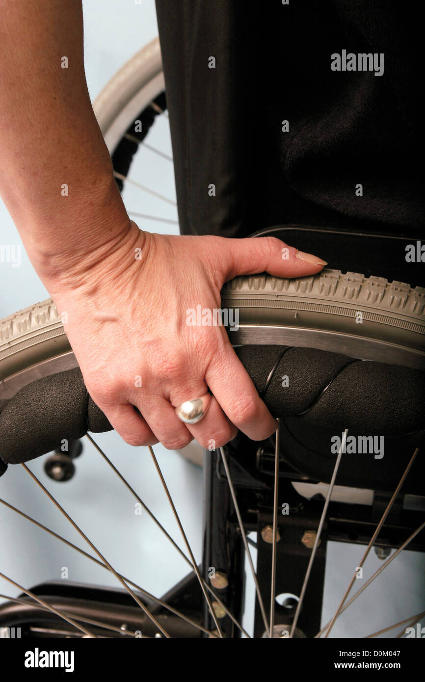 Hand Gripping Wheelchair Rim Stock Photo - Alamy