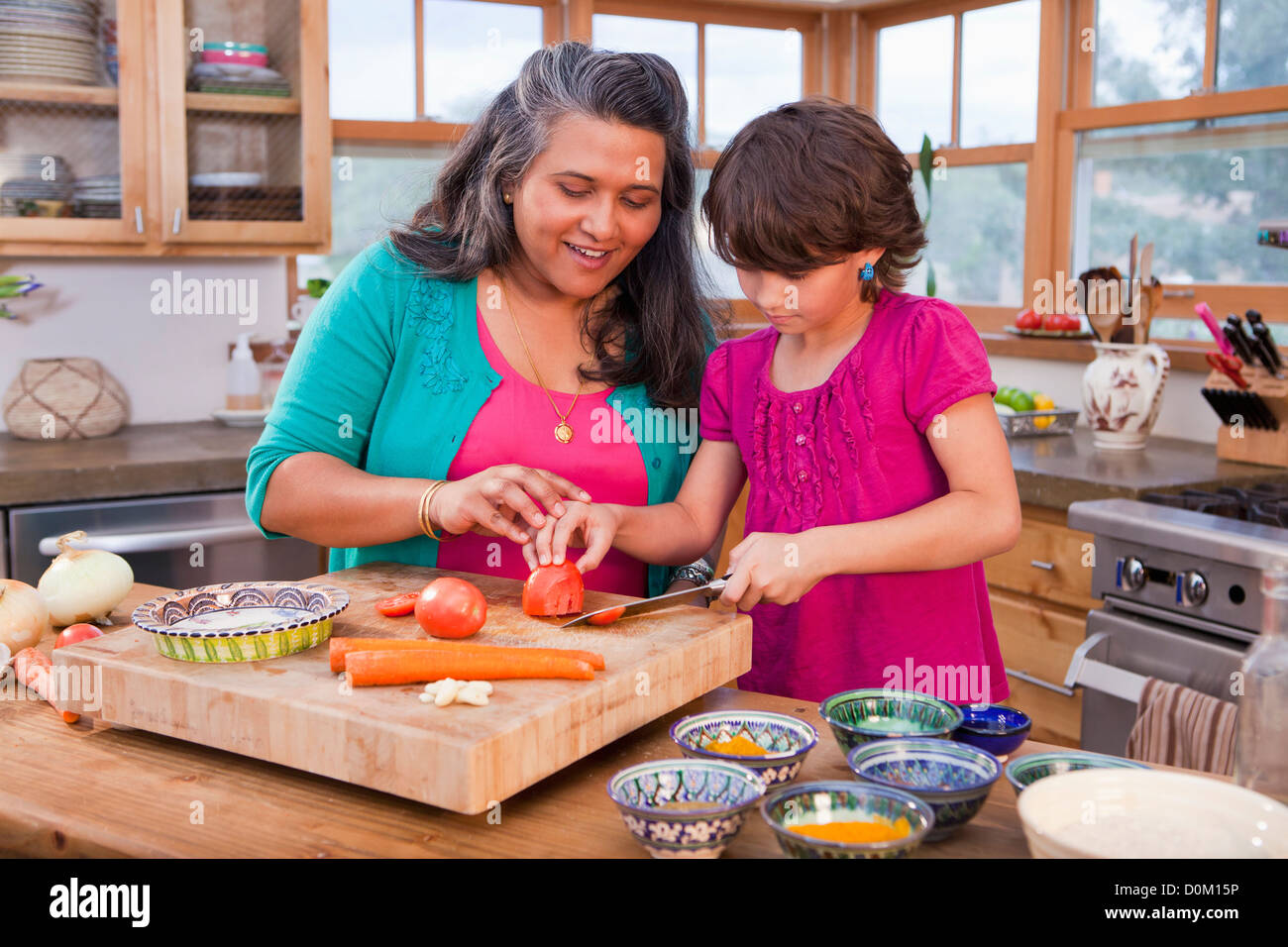 Mother and daughter cooking in kitchen Stock Photo - Alamy