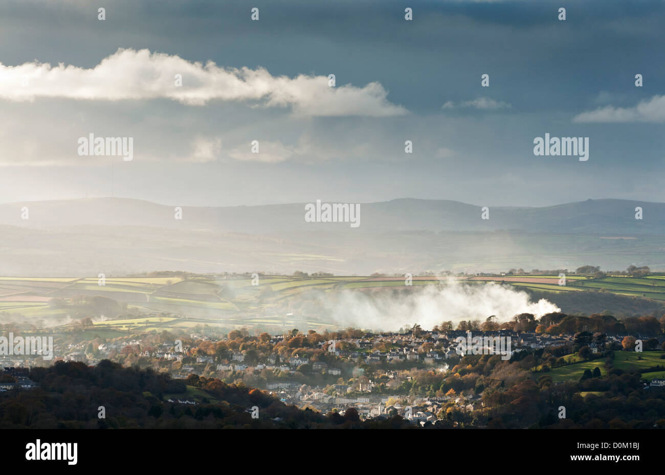 Smoke drifting across Tavistock in late afternoon sunshine, Devon UK ...