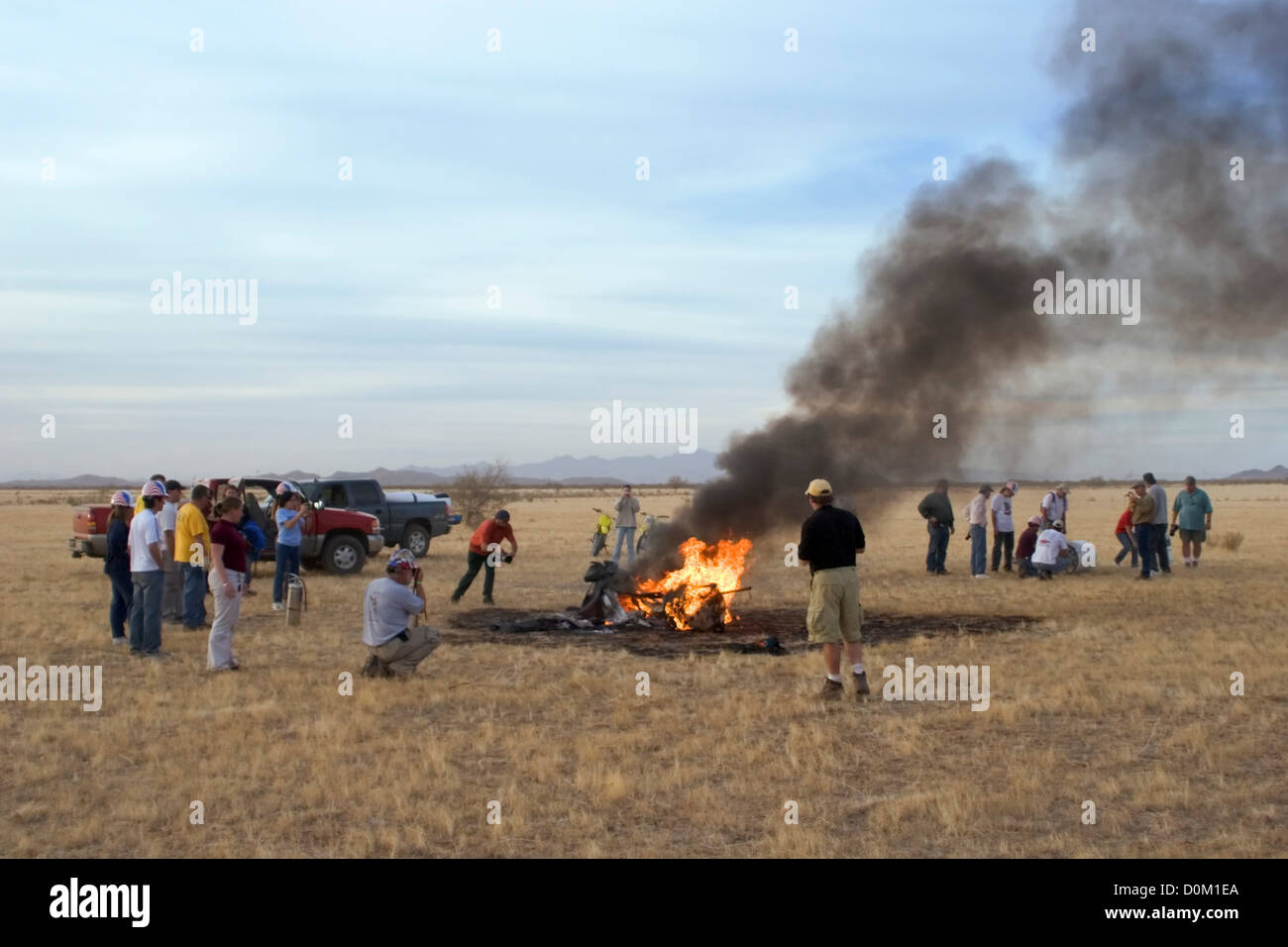 People Watch Rocket Wreckage Burn Stock Photo - Alamy