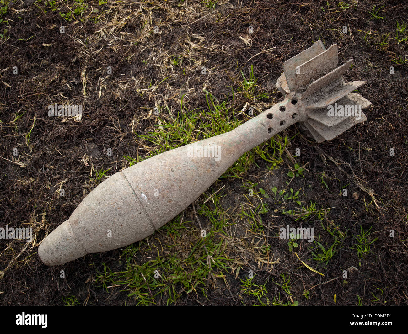 Old unexploded mortar shell grenade on the ground Stock Photo - Alamy