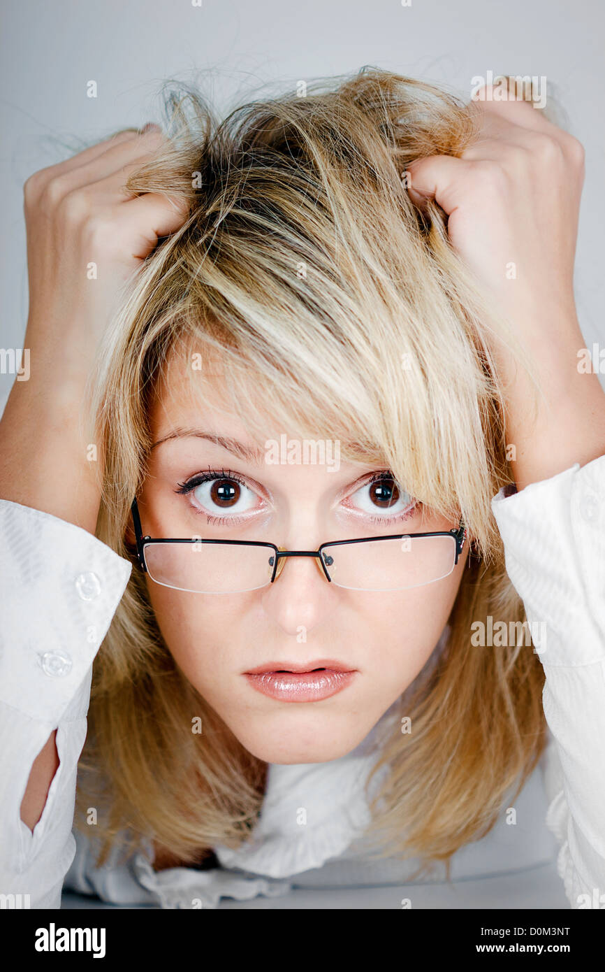 tired young businesswoman wearing glasses Stock Photo - Alamy