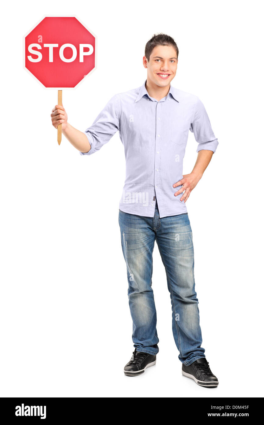 Full length portrait of a man holding a traffic sign stop isolated on ...
