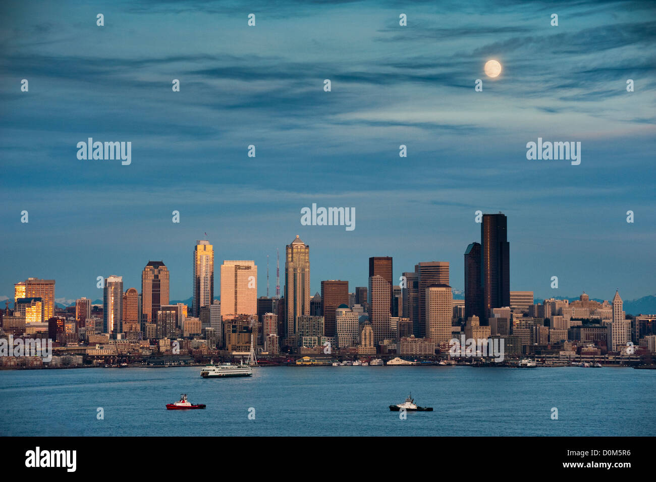 A full moon rises over the Seattle skyline during a clear autumn ...