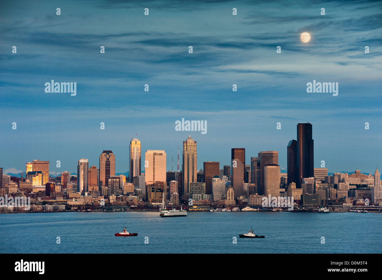 A full moon rises over the Seattle skyline during a clear autumn ...