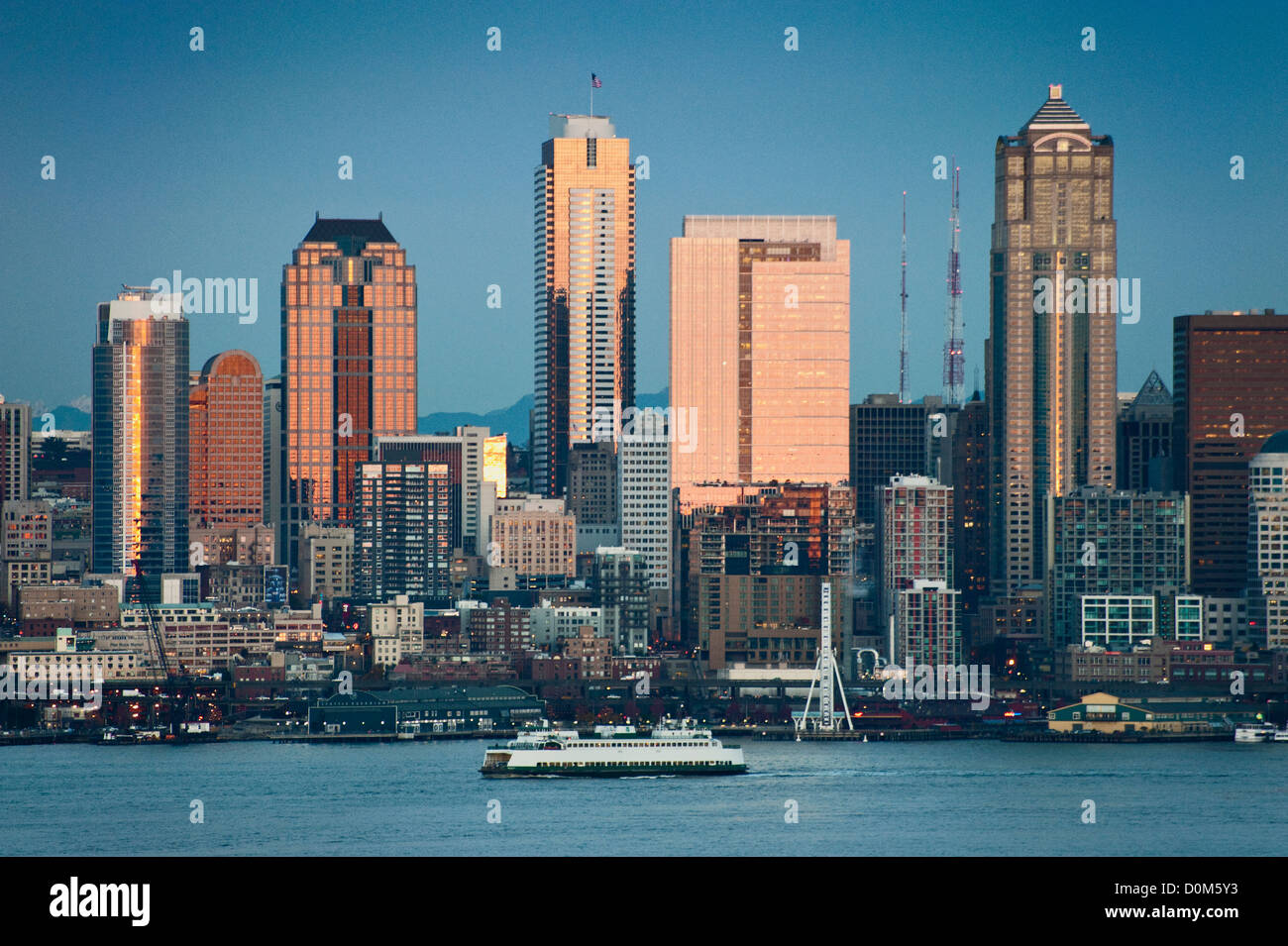 A beautiful autumn sunset illuminates the Seattle skyline taken from ...