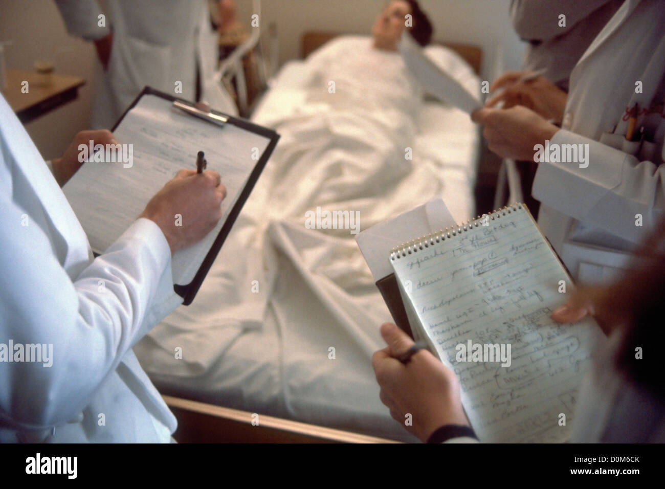 Doctors Examine Patient in Hospital Stock Photo - Alamy