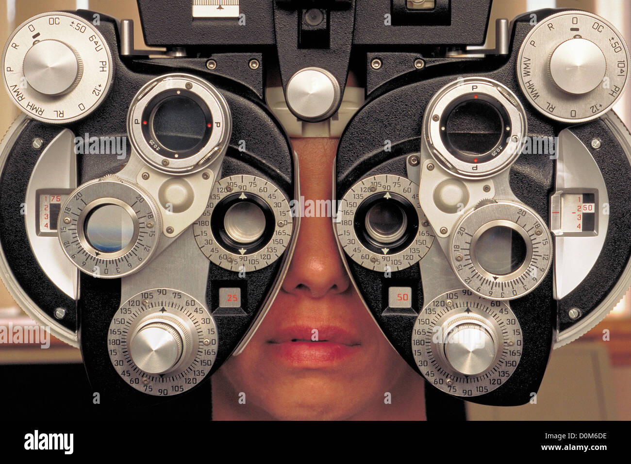Woman Behind Phoropter Stock Photo - Alamy