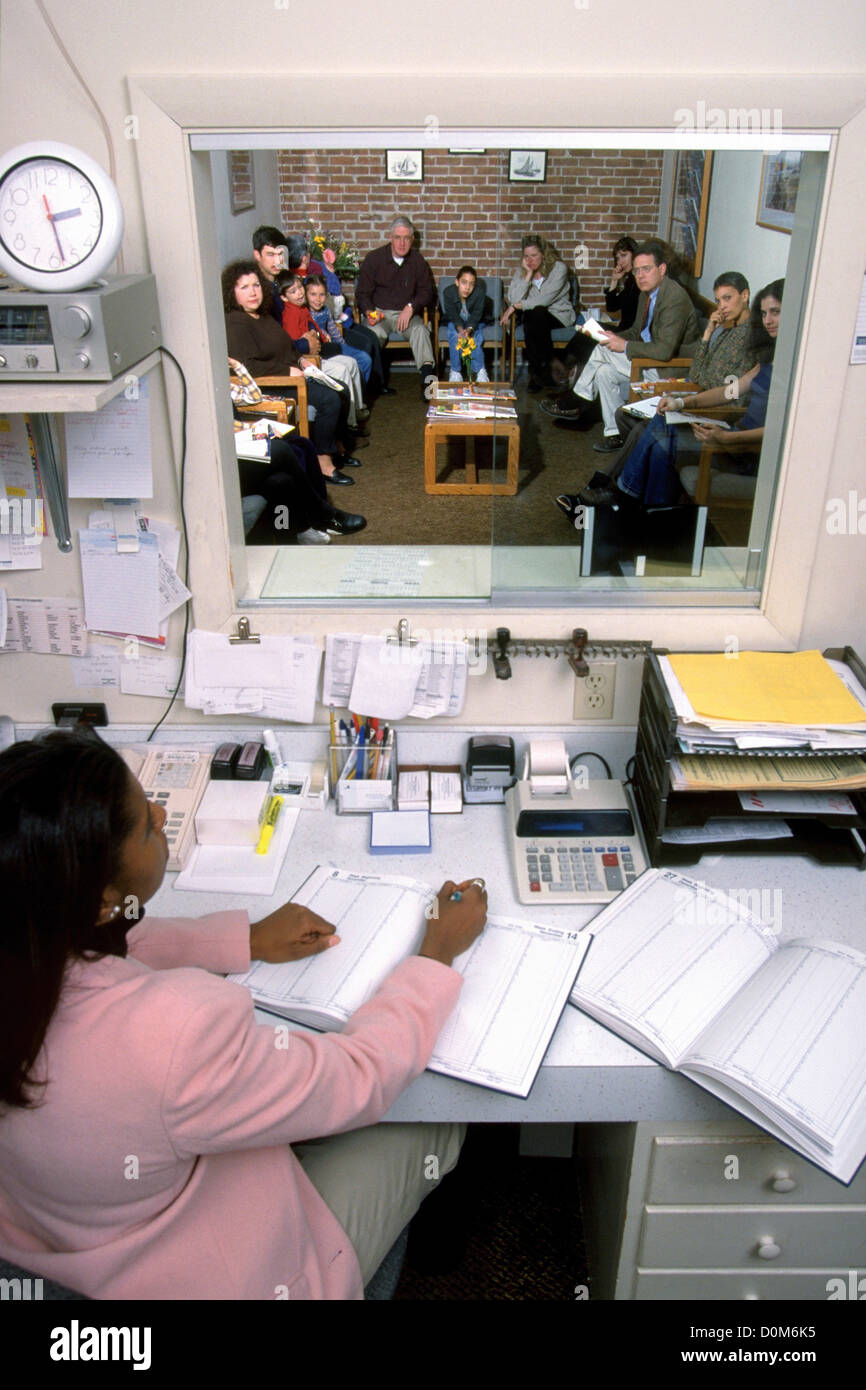 Receptionist Views Waiting Room Full of Angry Patients Stock Photo - Alamy