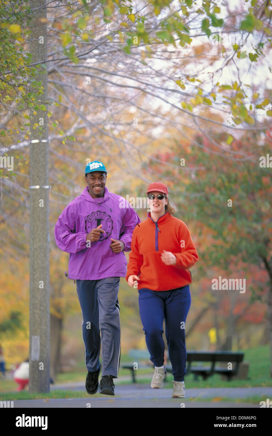 Man and Woman Jogging in the Park Stock Photo - Alamy