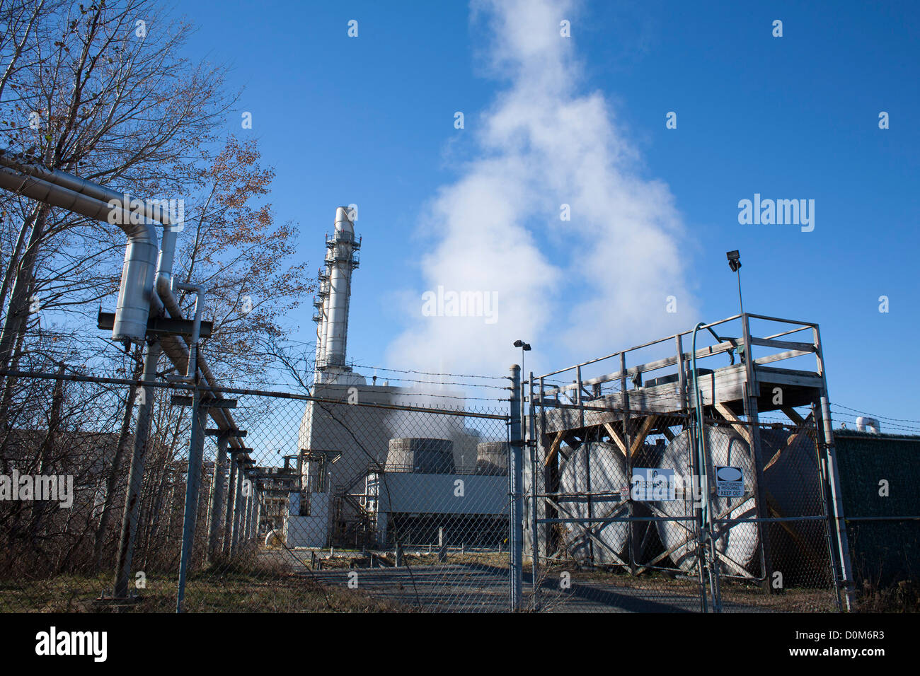 Steam rises from cooling tanks at a General Electric plant in ...
