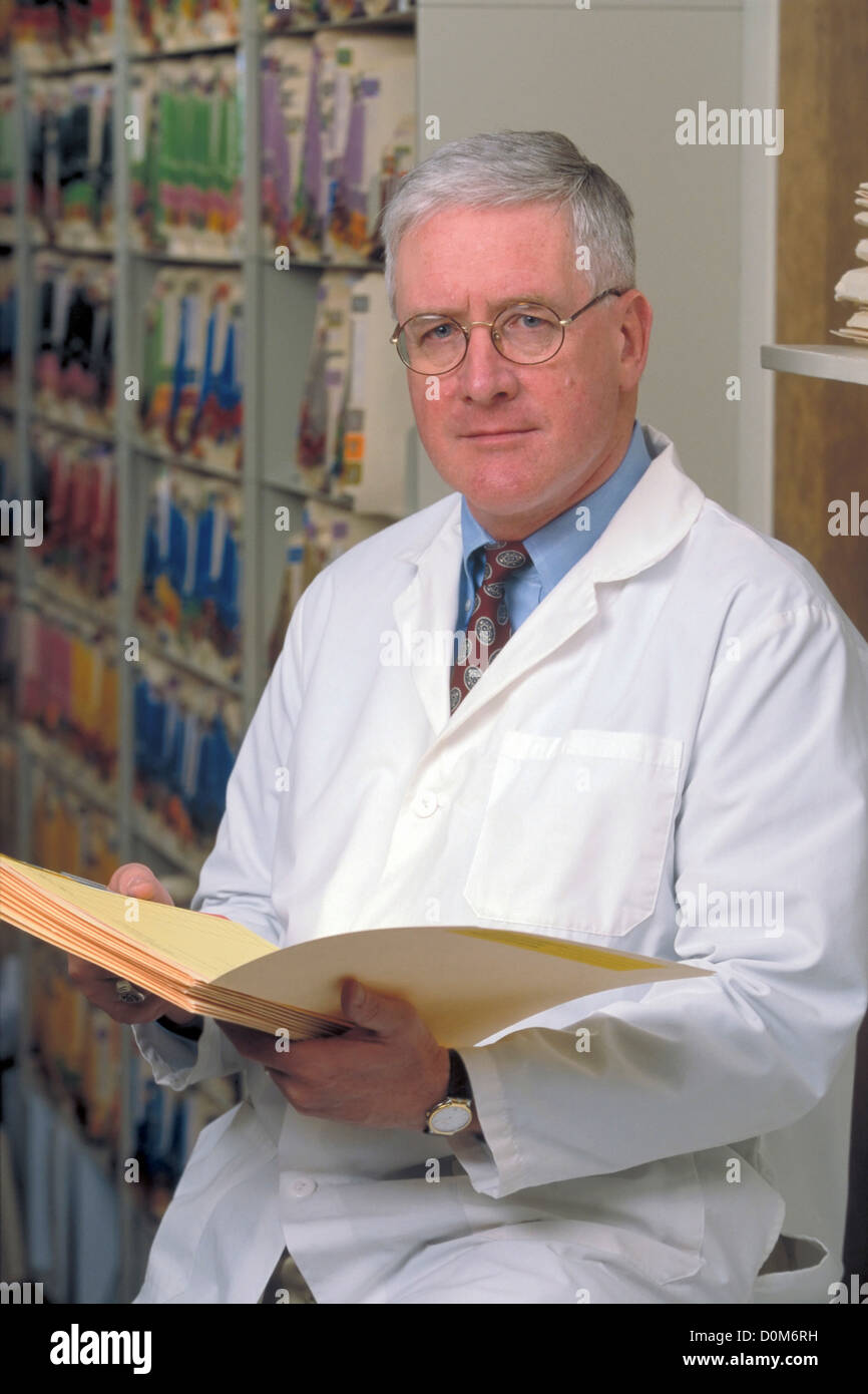 Portrait of Senior Physician Reading Charts Stock Photo - Alamy
