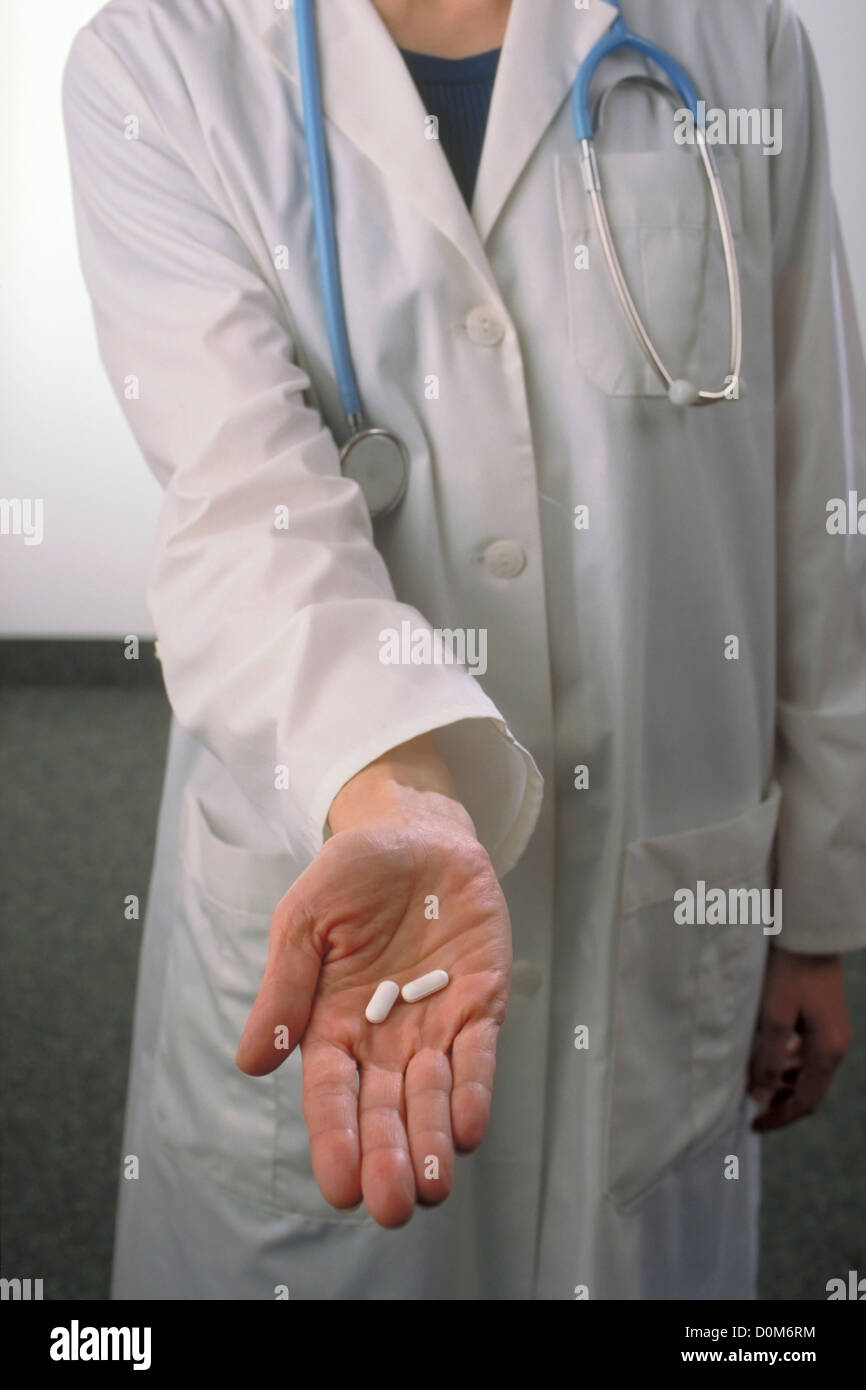 Doctor Extends Hand with Medicine Stock Photo - Alamy