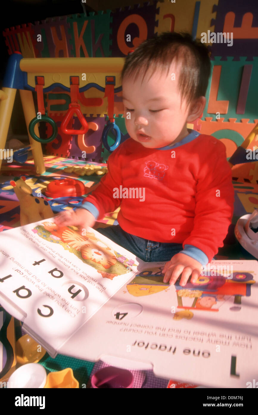 Toddler Reading Book Stock Photo - Alamy