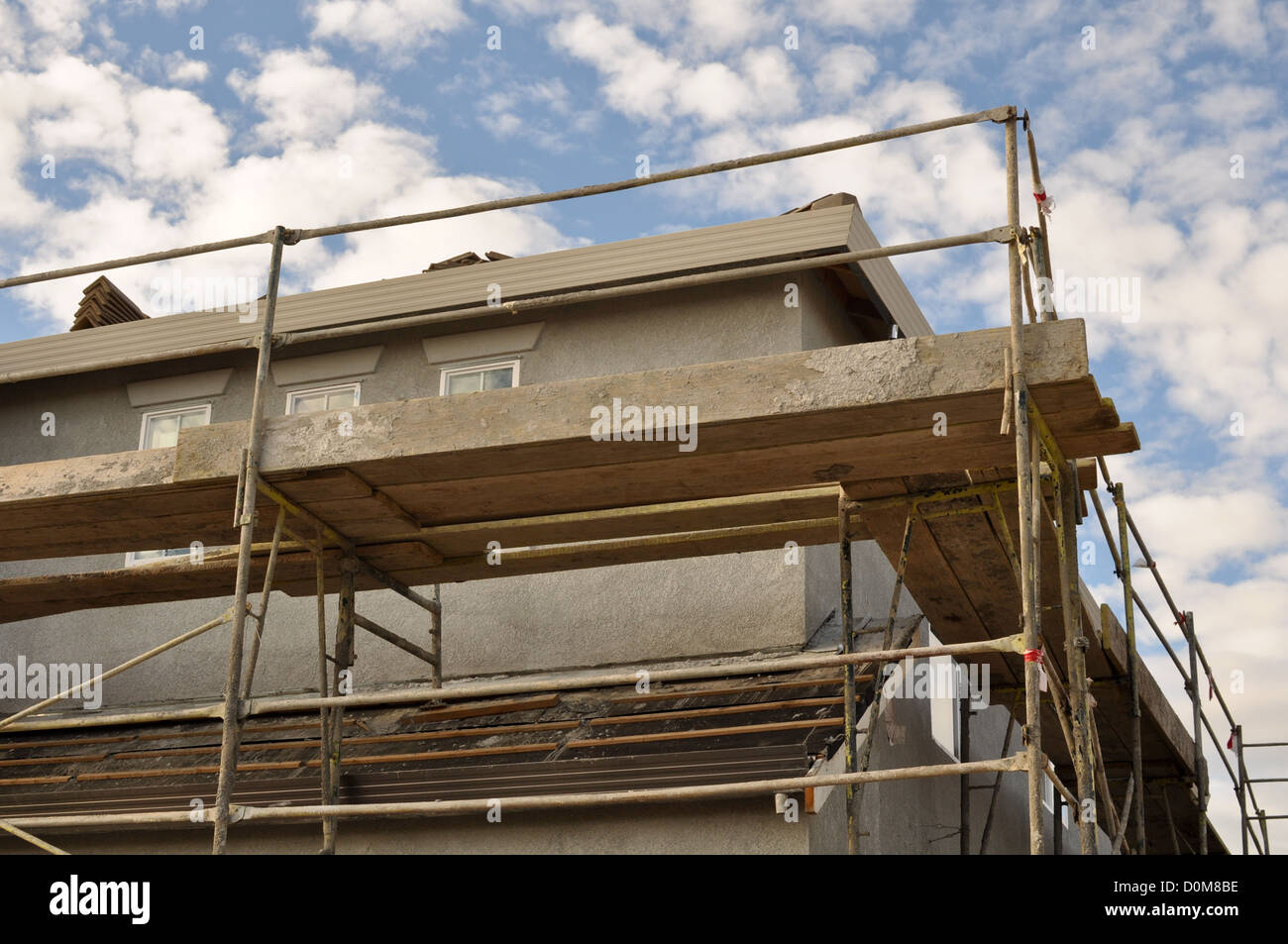 New Home Under Construction with Scaffolding Stock Photo - Alamy