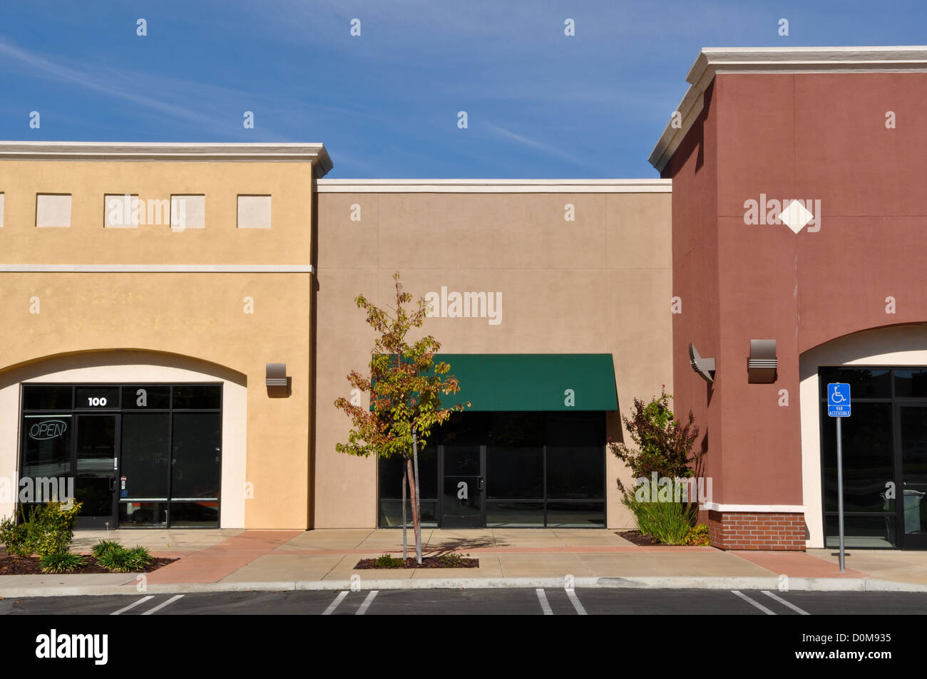 New Brown and Yellow Shopping Center Store Front Stock Photo - Alamy