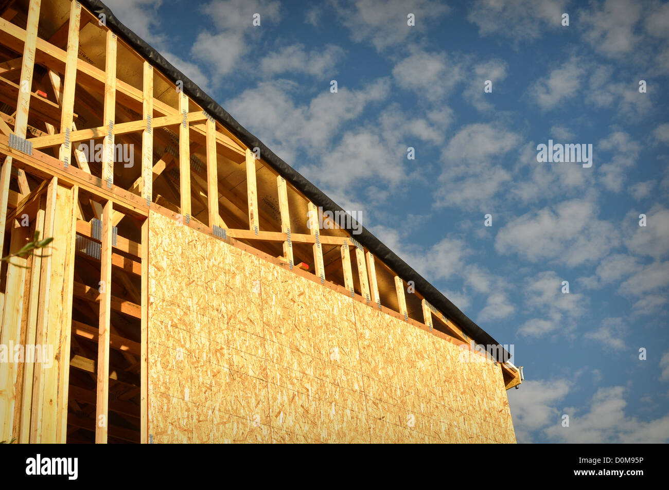 New Home Construction with Blue Sky and Clouds Stock Photo - Alamy