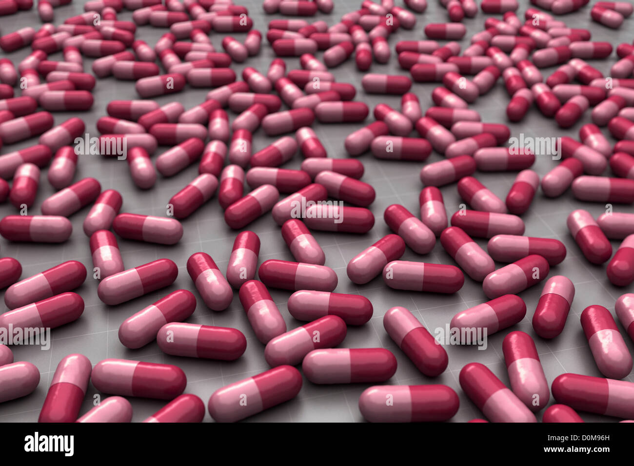 Multiple medication capsules spilled on gray surface Stock Photo - Alamy