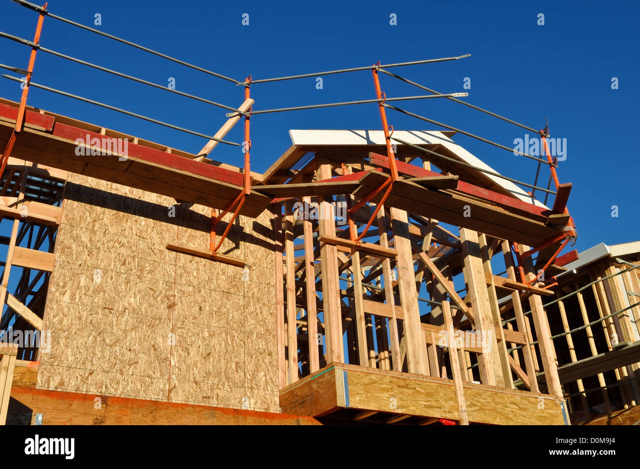 New Home Under Construction with Scaffolding Stock Photo - Alamy