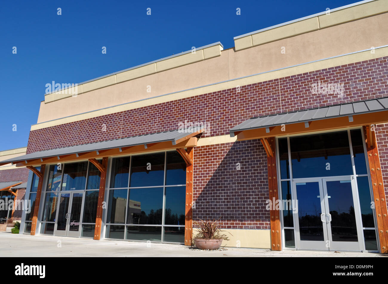 New Shopping Center made of Brick Facade Stock Photo - Alamy